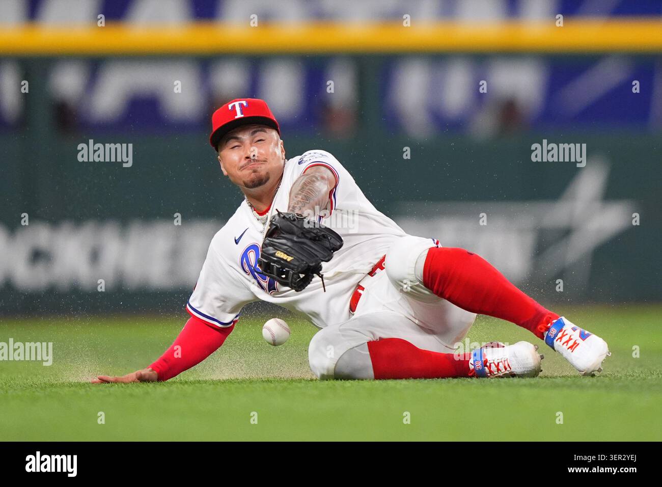 Texas Rangers left fielder Cody Freeman can't catch the fly allowing a ...
