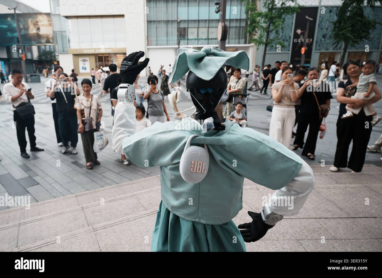 HANGZHOU, CHINA - JUNE 17, 2026 - Tourists watch the Unitree G1 ...