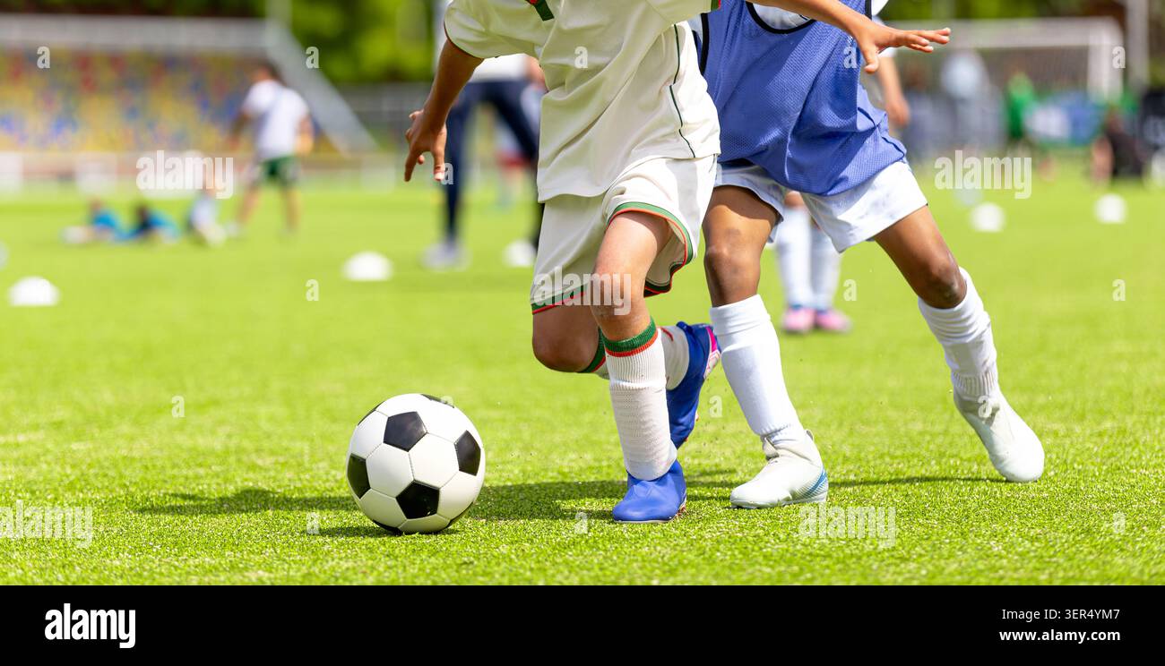 Kids Football Dribbling Drill: Close-Up of Young Player Controlling ...