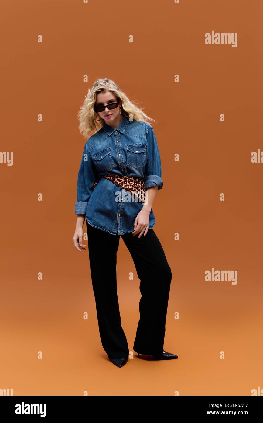 Blonde woman poses in denim, displaying modern style and confidence ...