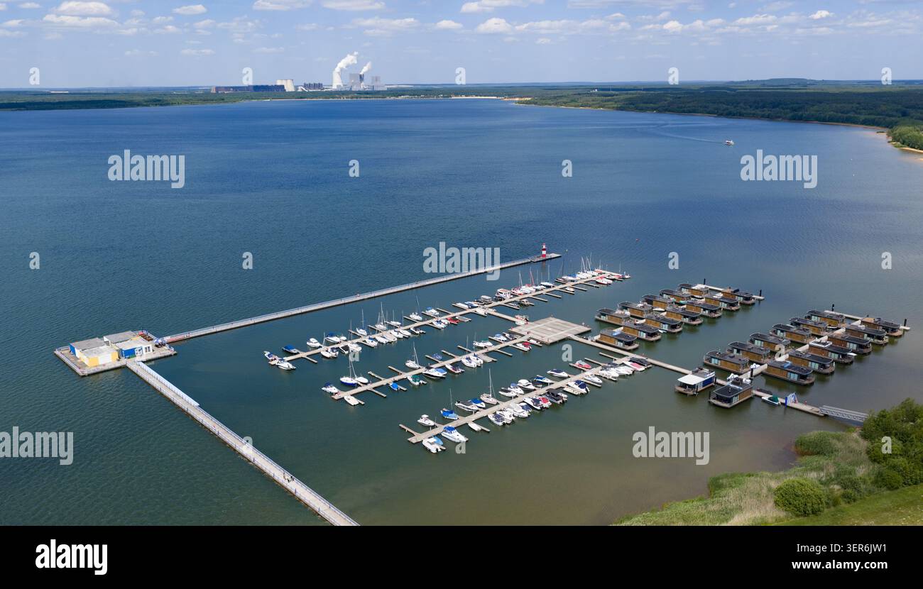 17 June 2026, Saxony, Klitten: Boats are moored in Klitten Harbor on ...