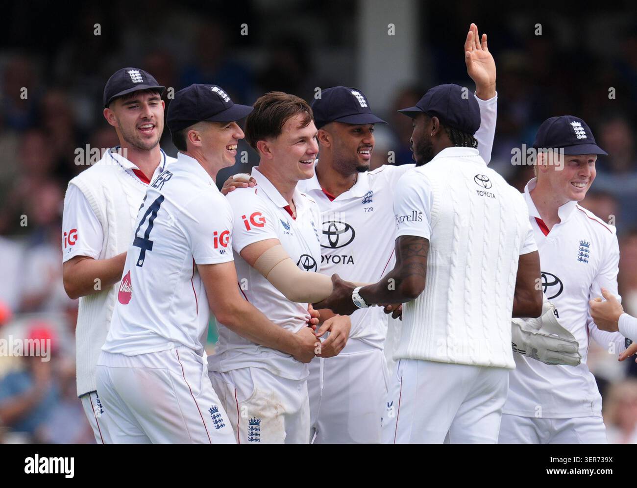 England's Sonny Baker (third left) celebrates taking the wicket of New ...