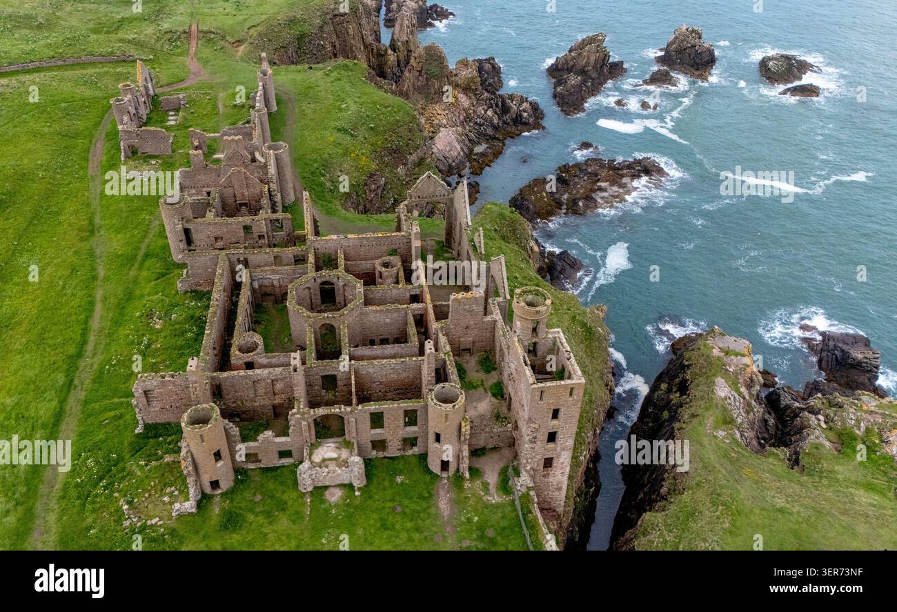 The ruins of the 16th century Slains Castle, perched high on the cliffs ...