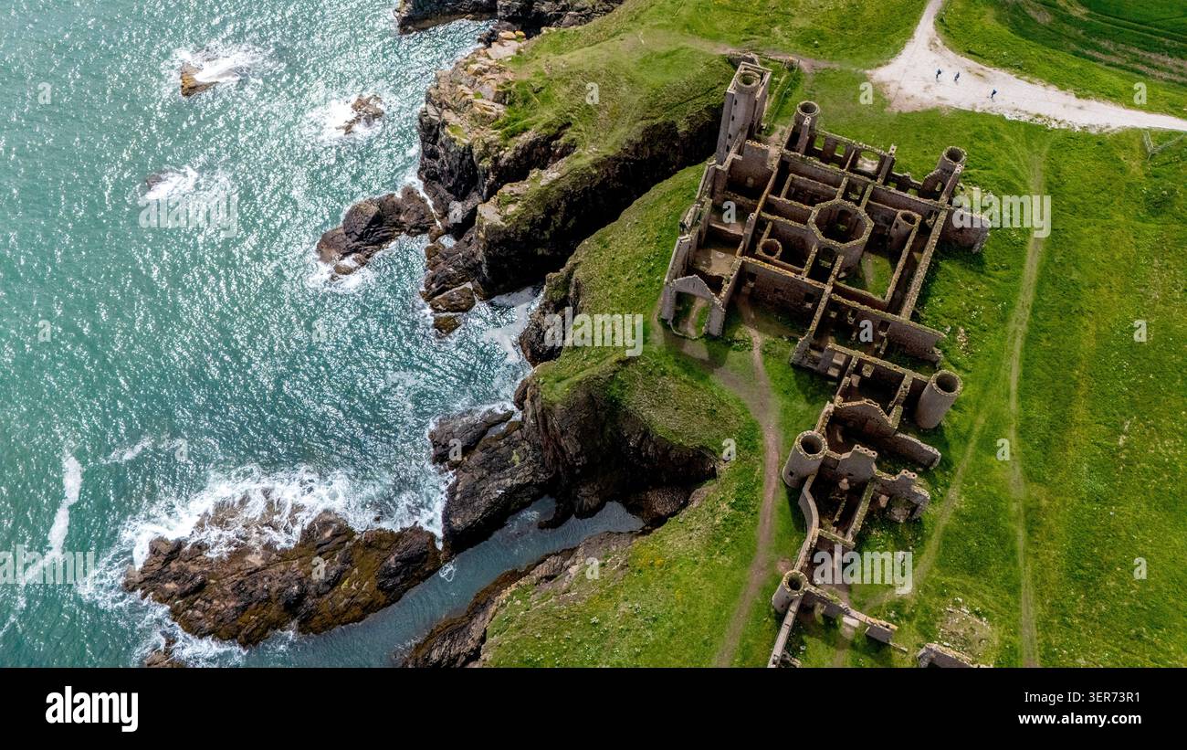 The ruins of the 16th century Slains Castle, perched high on the cliffs ...