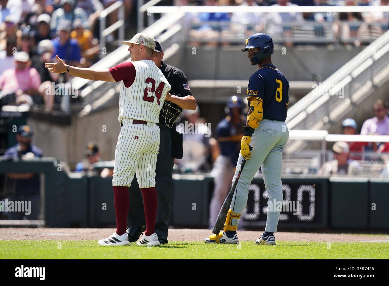 Troy head coach Skylar Meade questions a play during an NCAA baseball ...