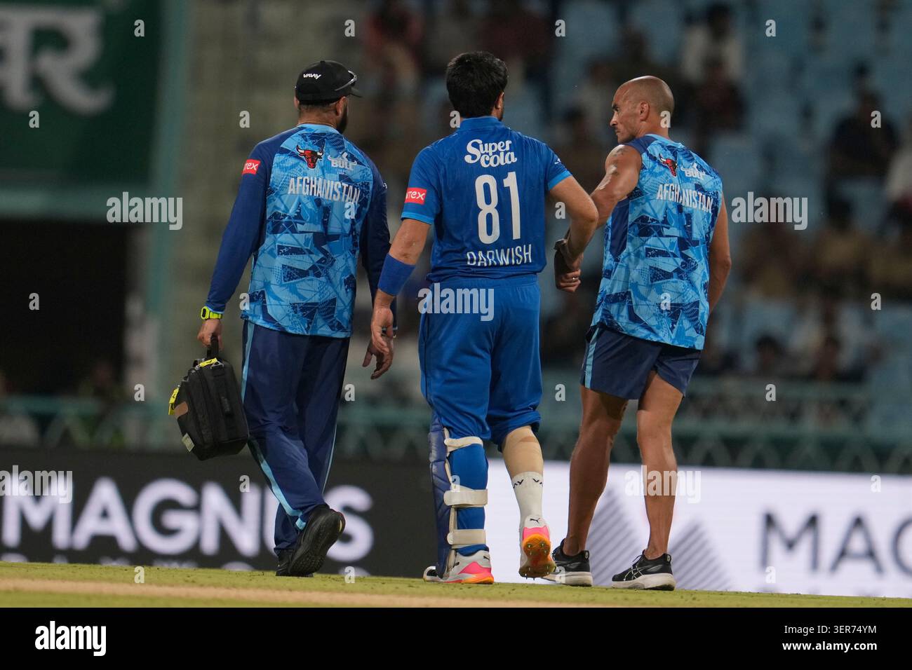 Afghanistan's Darwish Rasooli, center, walks back to pavilion after ...