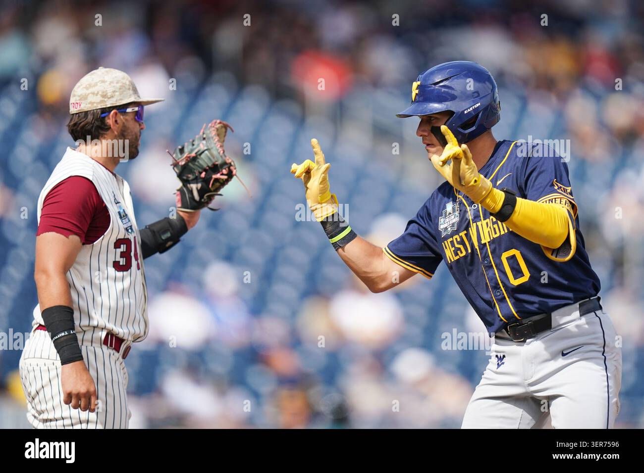 West Virginia utility Matthew Graveline (0) reacts after getting a hit ...