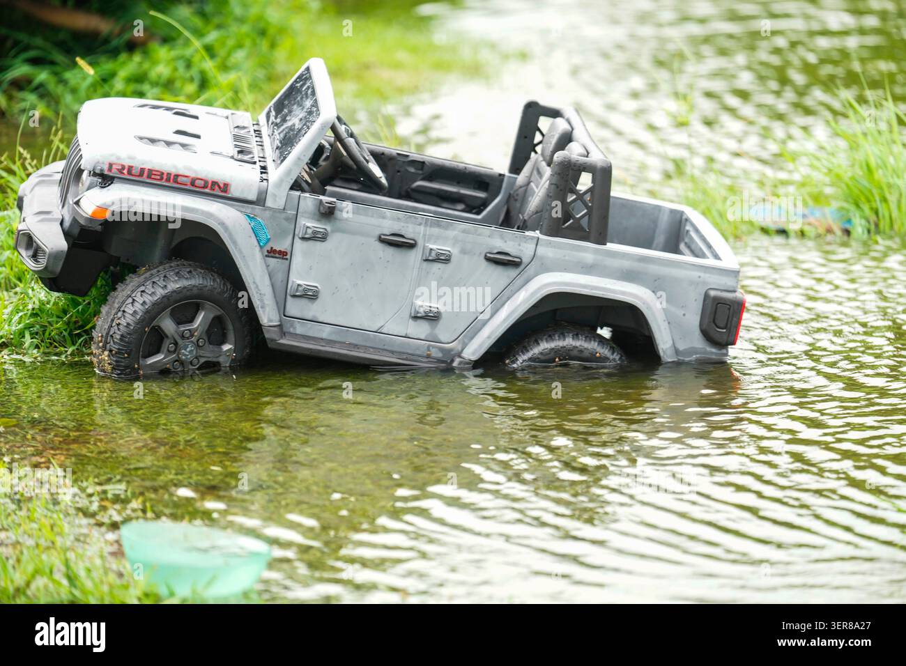 Water surrounds a toy Jeep in the aftermath of Tropical Storm Arthur in ...