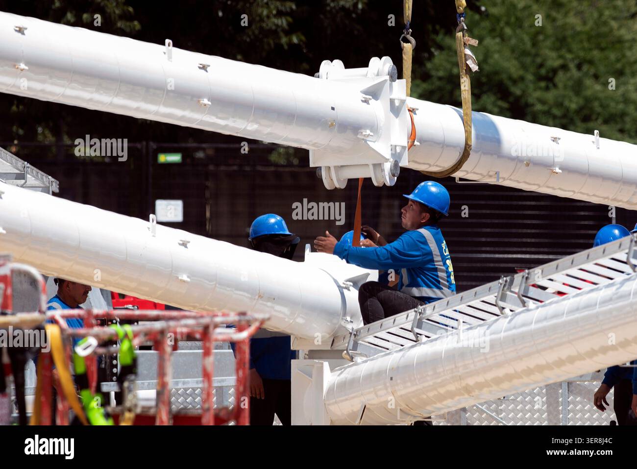Workers are erecting a 110-foot ferris wheel for the Great American ...