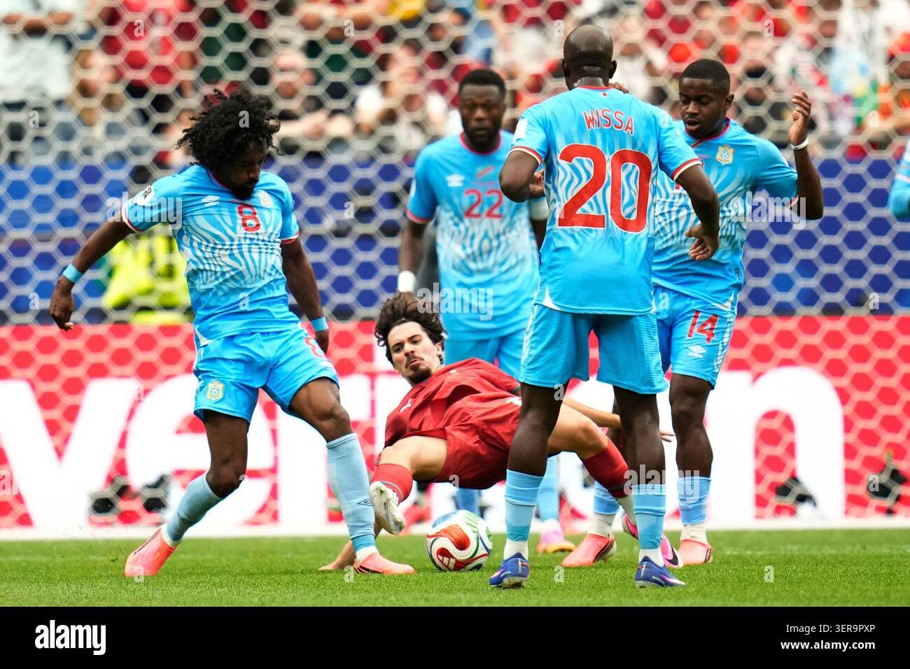 Portugal's Vitinha, bottom, challenges for the ball with Congo's Samuel ...