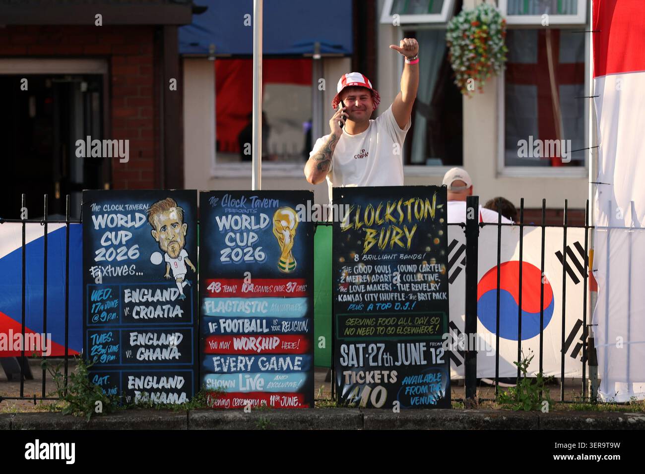 An England supporter awaits the screening of the World Cup soccer match ...
