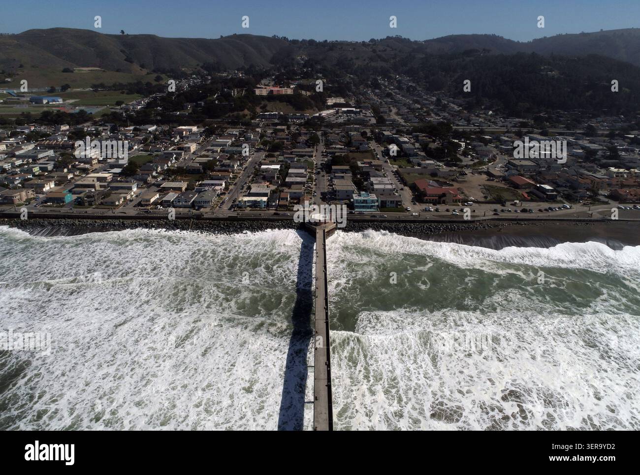 The Pacifica Municipal Pier extends out over Sharp Park Beach in ...