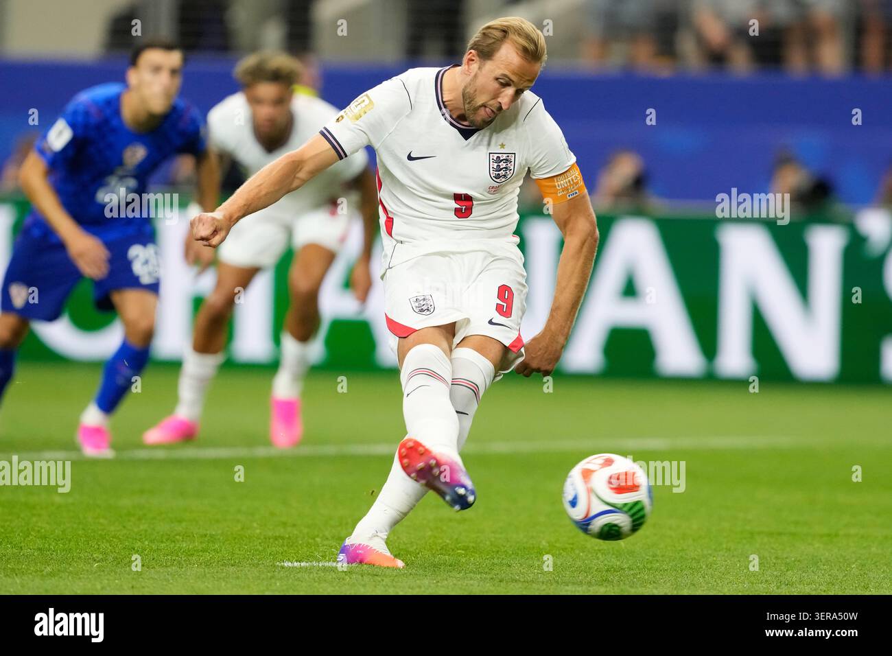 England's Harry Kane (9) scores his team's opening goal on a penalty ...