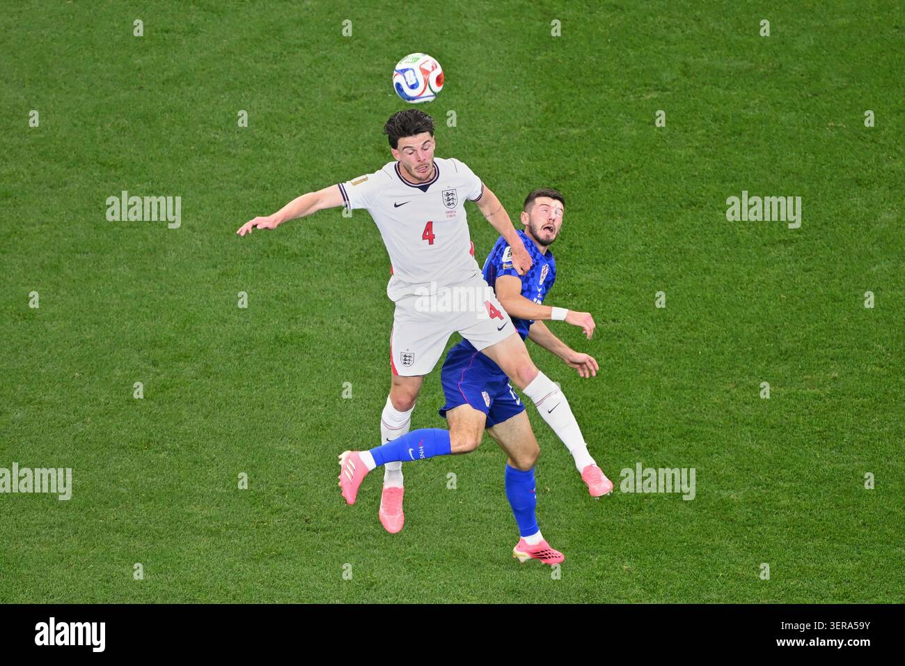 England's Declan Rice (4) battles for a header with Croatia's Petar ...