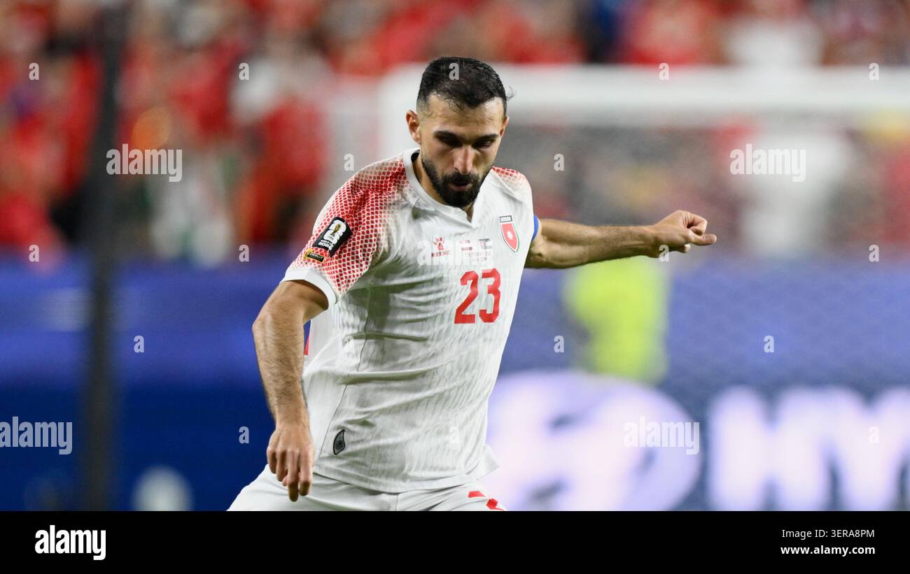 Jordan's Ehsan Haddad (23) kicks the ball during the World Cup Group J ...