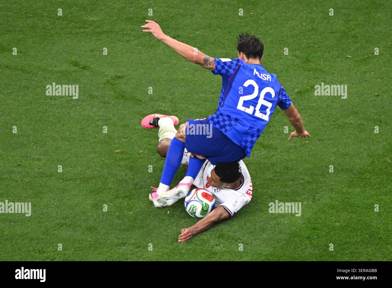 England's Jude Bellingham (10) battles for the ball with Croatia's ...