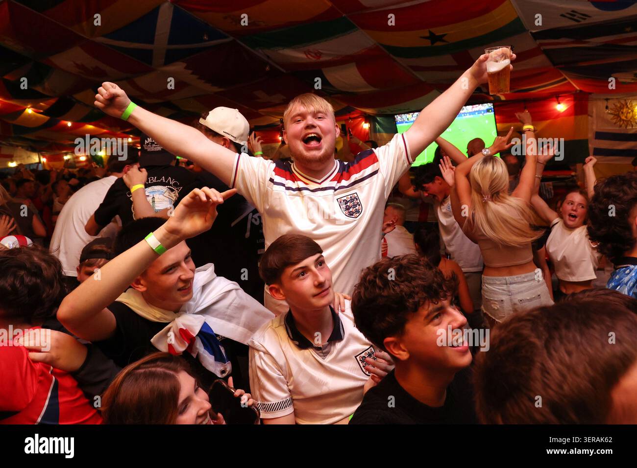 England supporters celebrate during the World Cup soccer match between ...