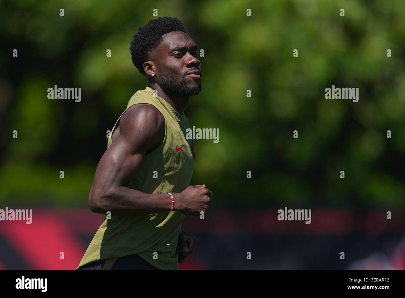 Canada's Alphonso Davies works out during a training session on the eve ...