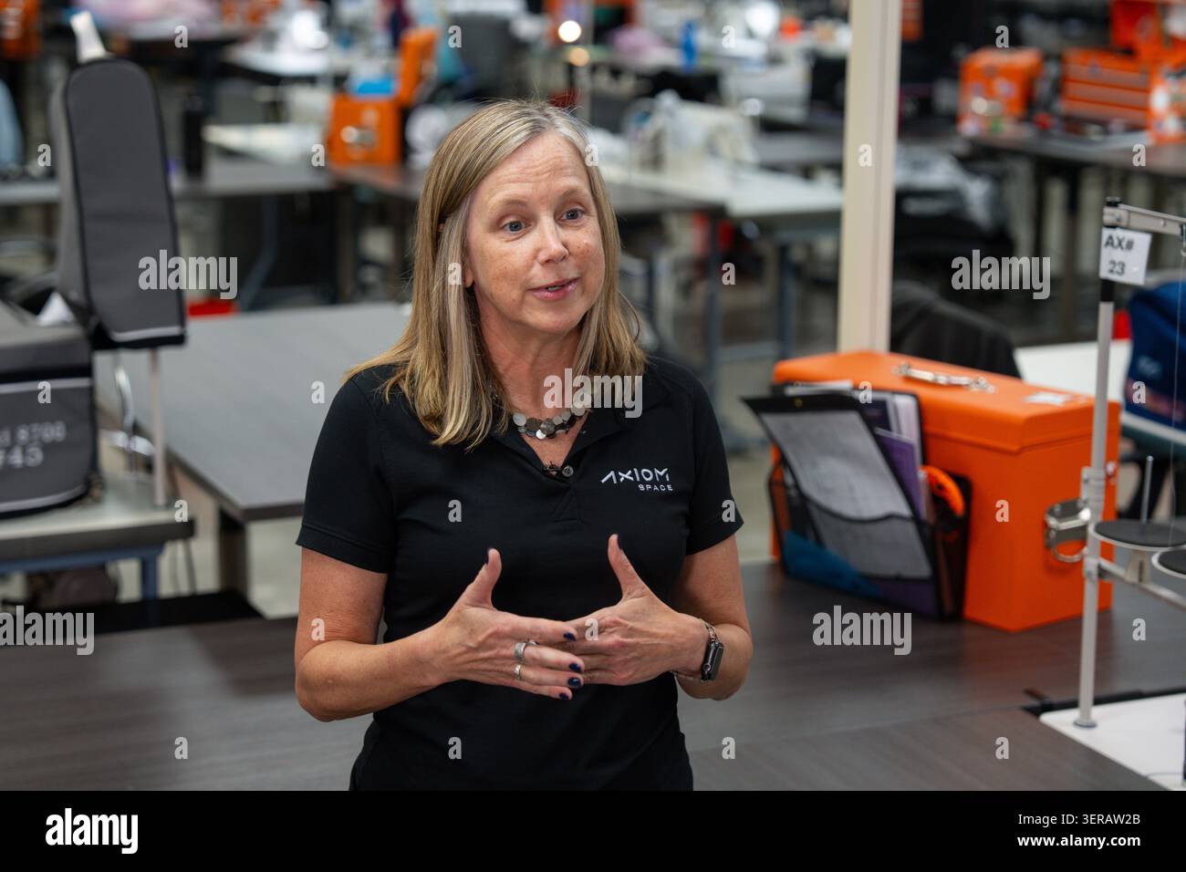 Michelle Stein, a senior program manager with KBR, speaks to a video ...