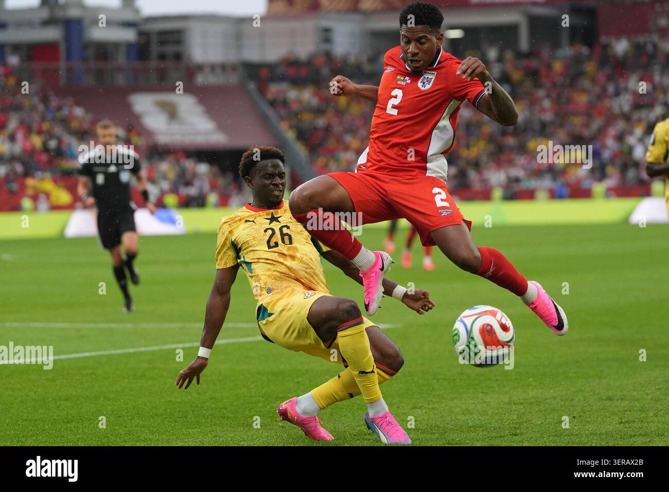 Panama's Cesar Blackman, right, jumps over Ghana's Marvin Senaya during ...