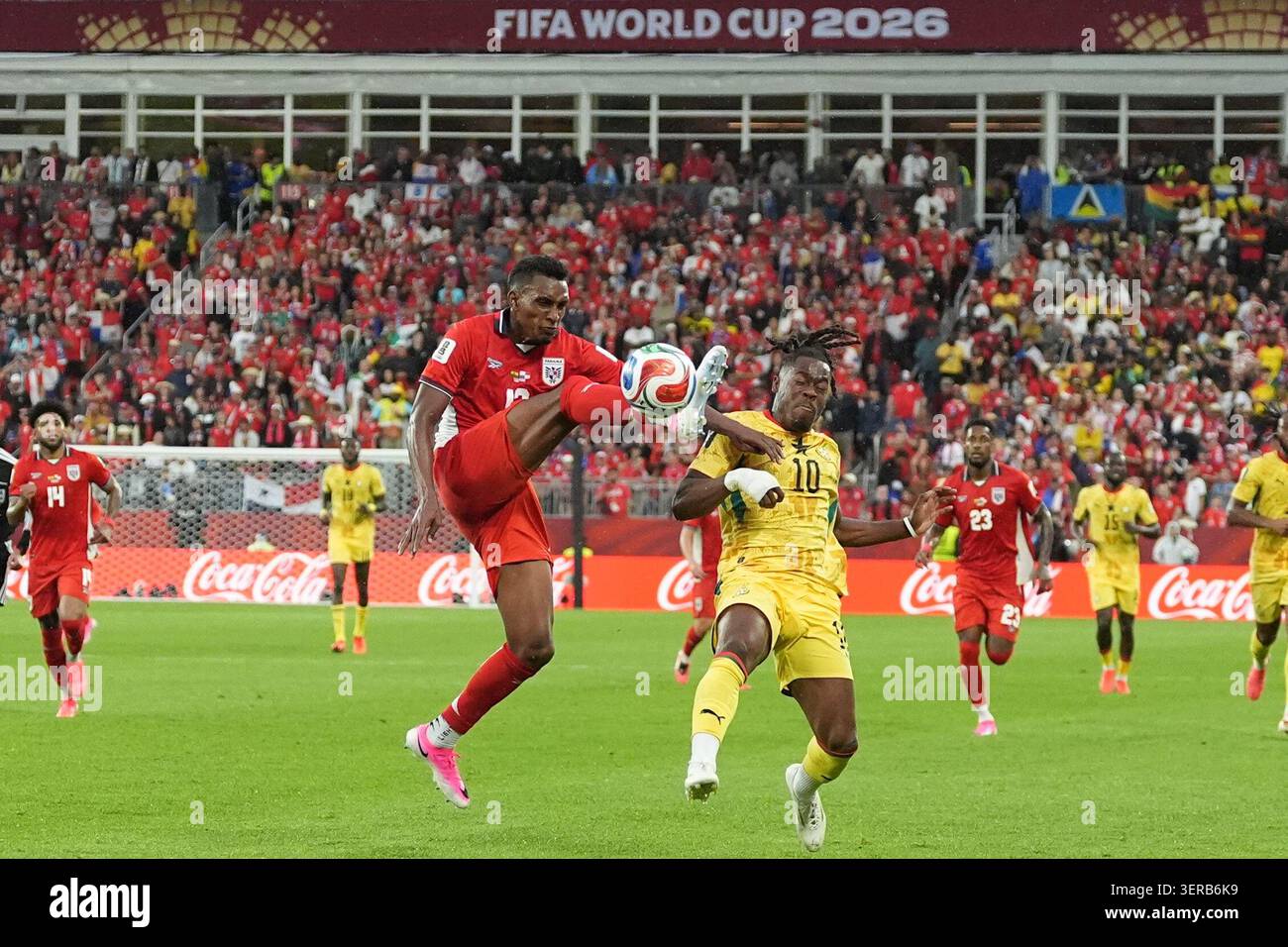 Panama's Jiovany Ramos, left, jumps for the ball past Ghana's Brandon ...