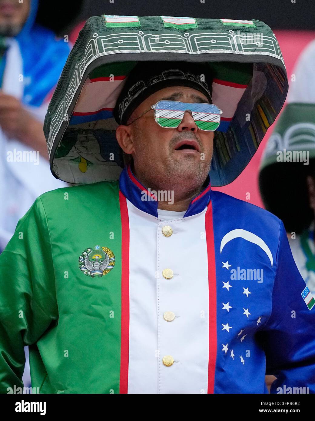 A Uzbekistan supporter reacts ahead of the World Cup Group K soccer ...