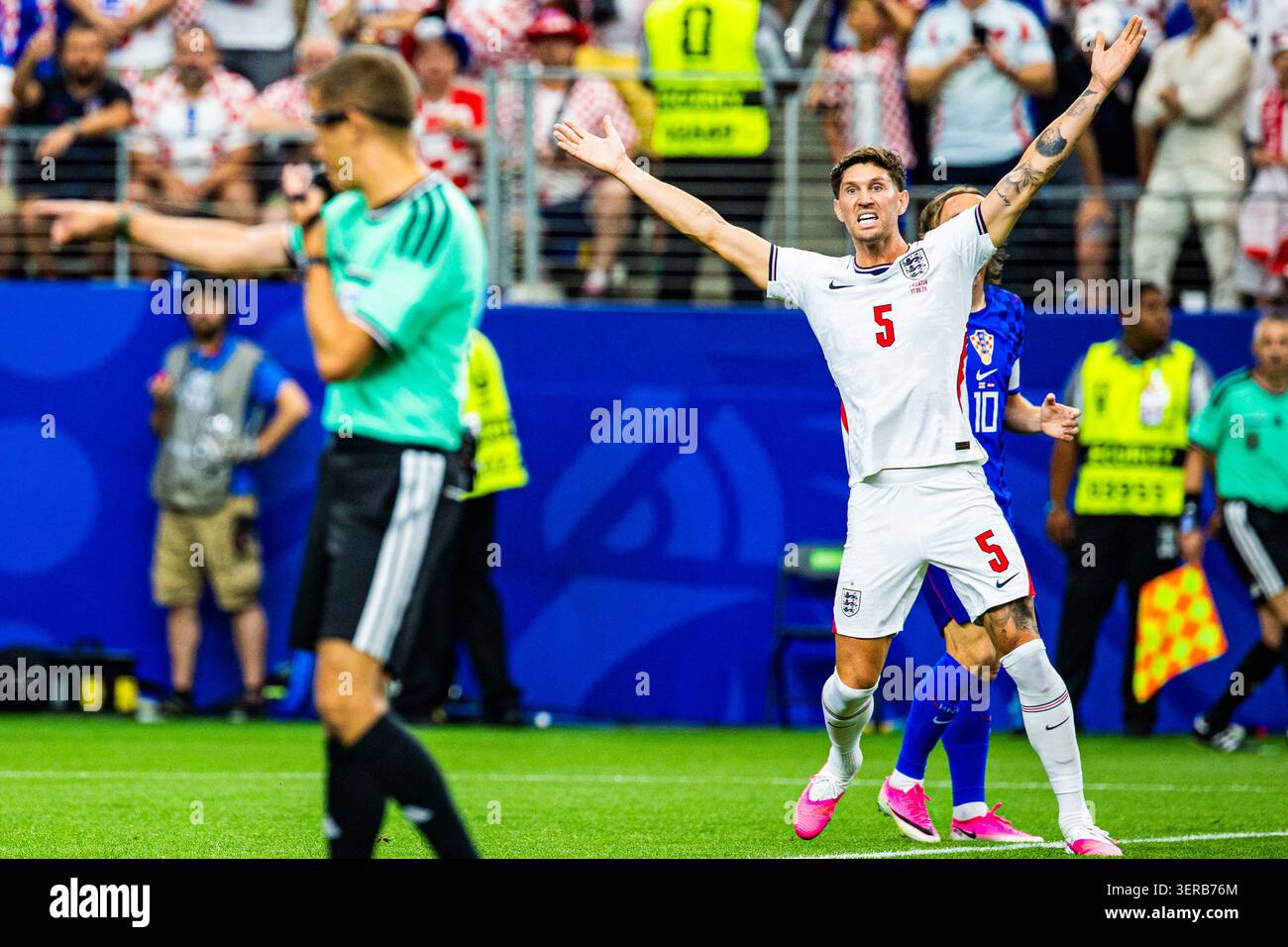 England defender John Stones (5) reacts to the referee during the ...
