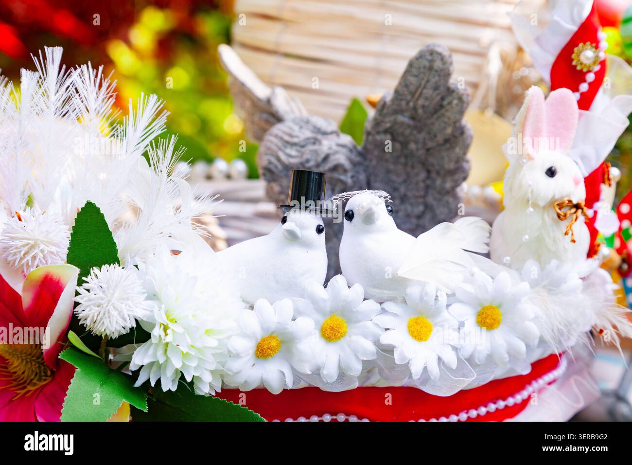 Easter or wedding arrangement with white dove figurines as bride and ...
