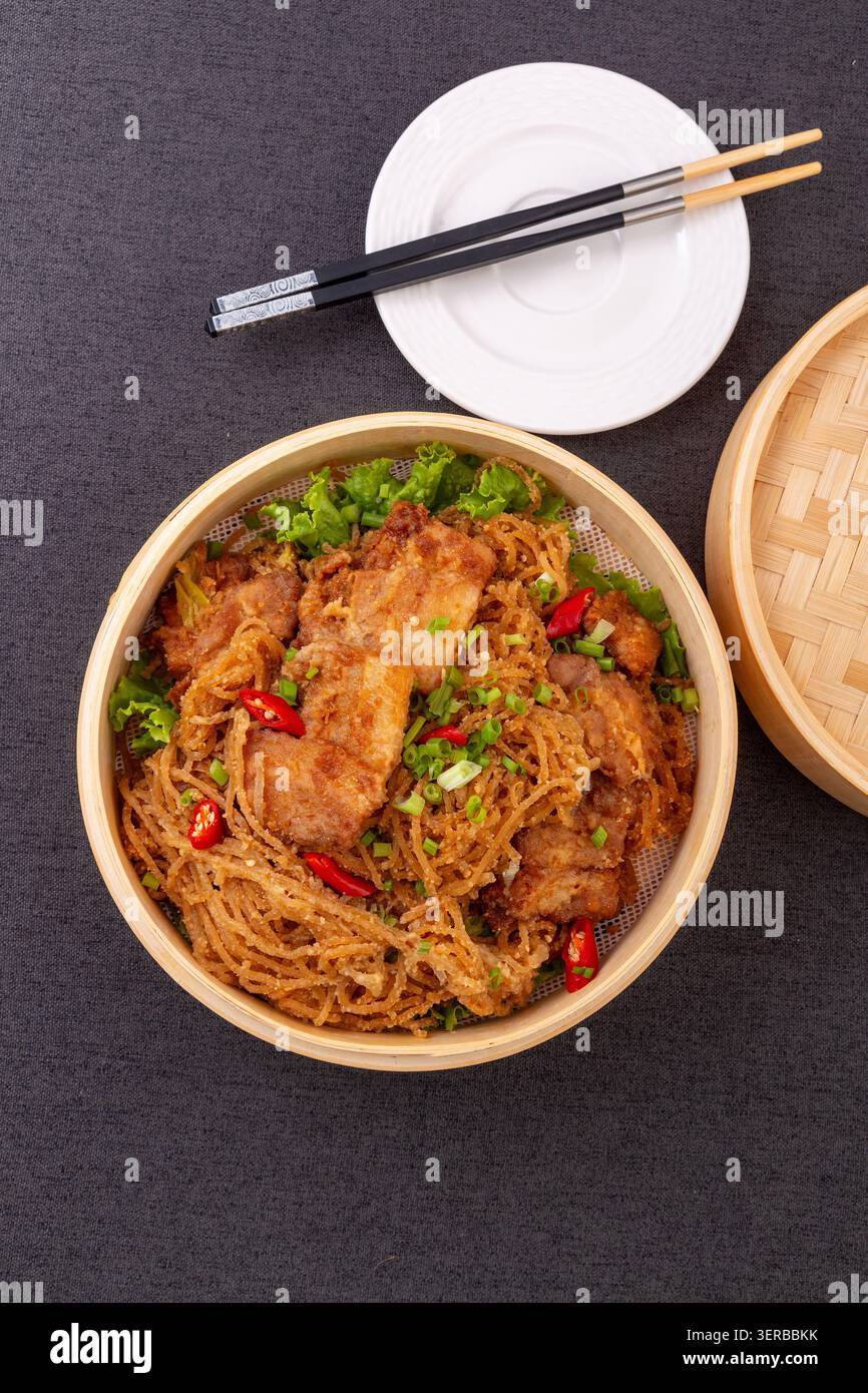 Steamed pork belly with toasted rice flour in bamboo steamer ...