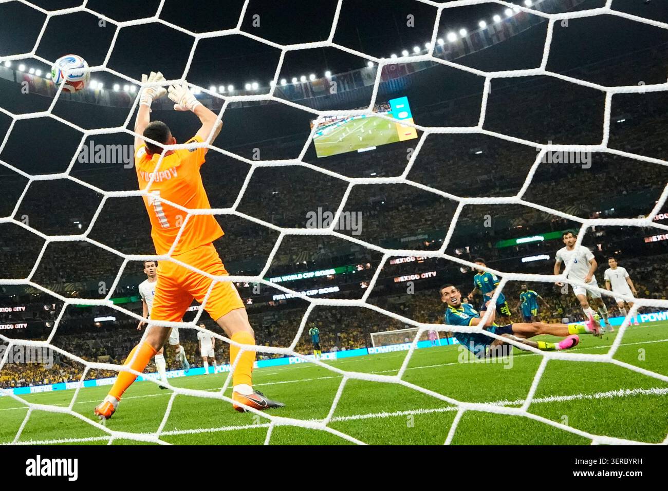 Colombia's Daniel Munoz, bottom, scores his team's first goal during ...
