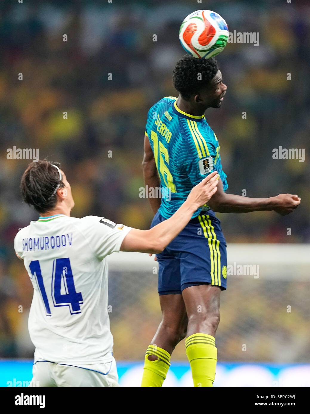 Colombia's Jefferson Lerma, right, heads the ball away from Uzbekistan ...