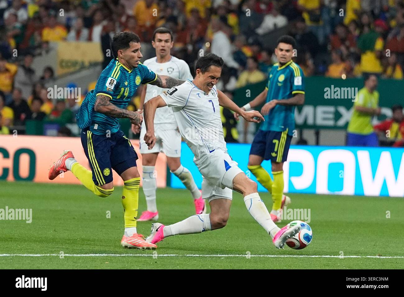 Uzbekistan's Otabek Shukurov (7) kicks the ball away from Colombia's ...