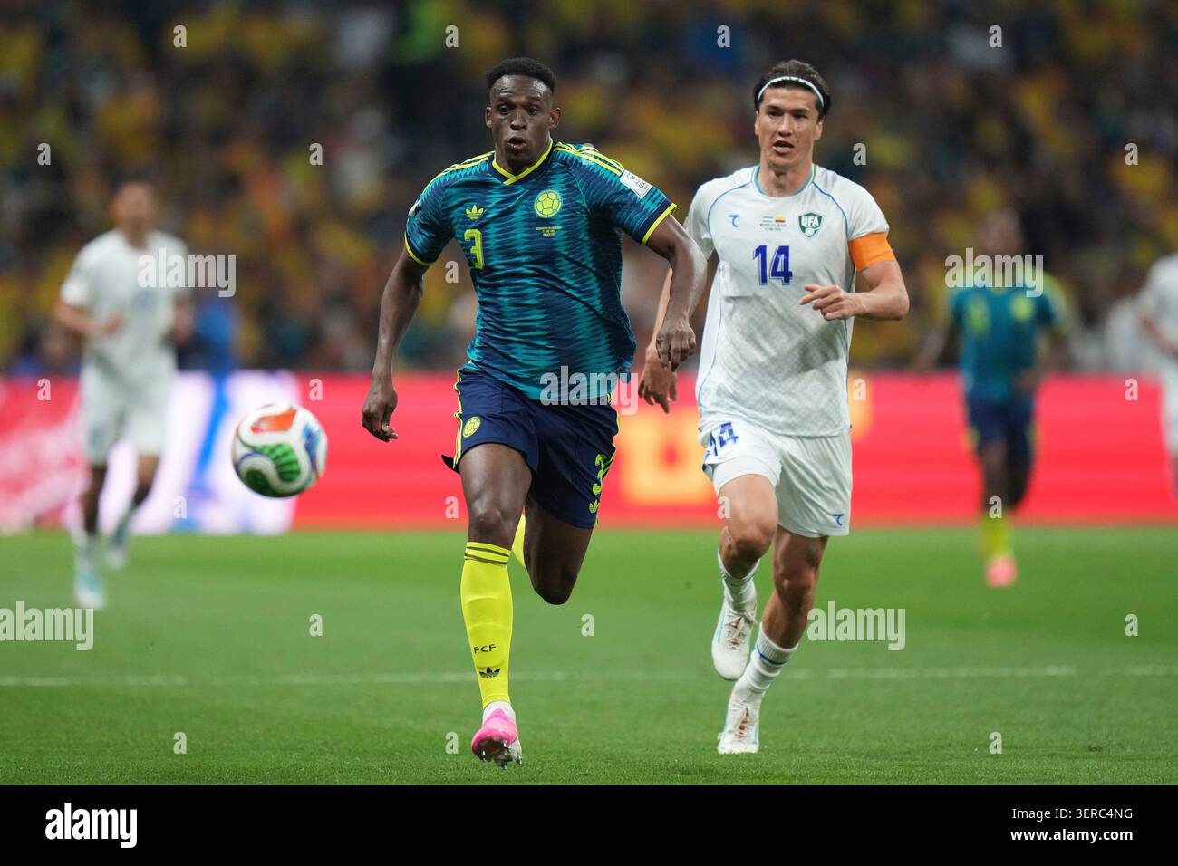 Colombia's Jhon Lucumi (3) battles for the ball with Uzbekistan's Eldor ...