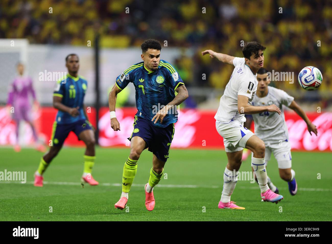 Colombia's Luis Diaz (7) and Uzbekistan's Abdukodir Khusanov (2) chase ...