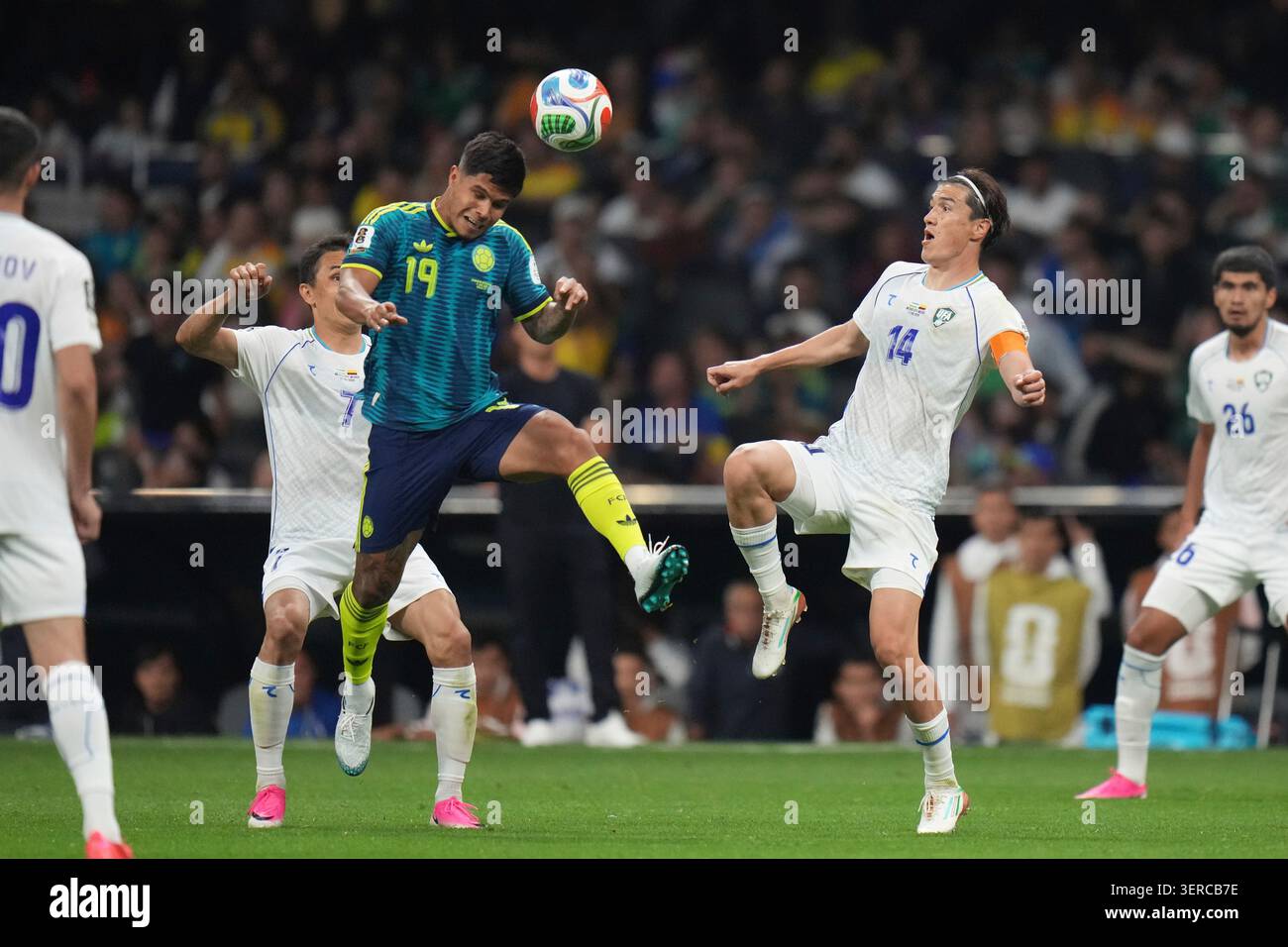 Colombia's Cucho Hernandez (19) battles for the ball with Uzbekistan's ...