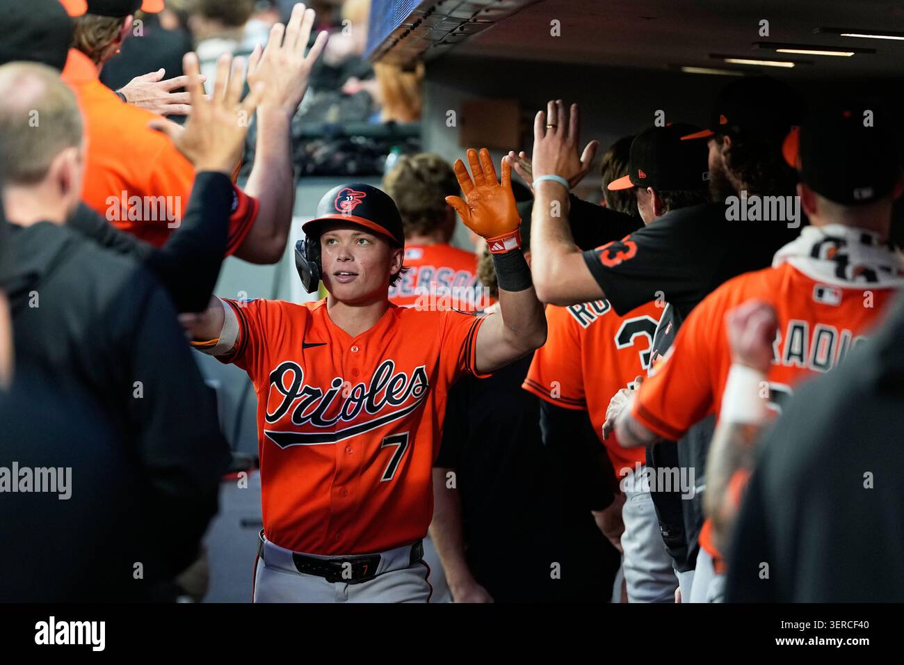 Baltimore Orioles' Jackson Holliday is greeted in the dugout after ...