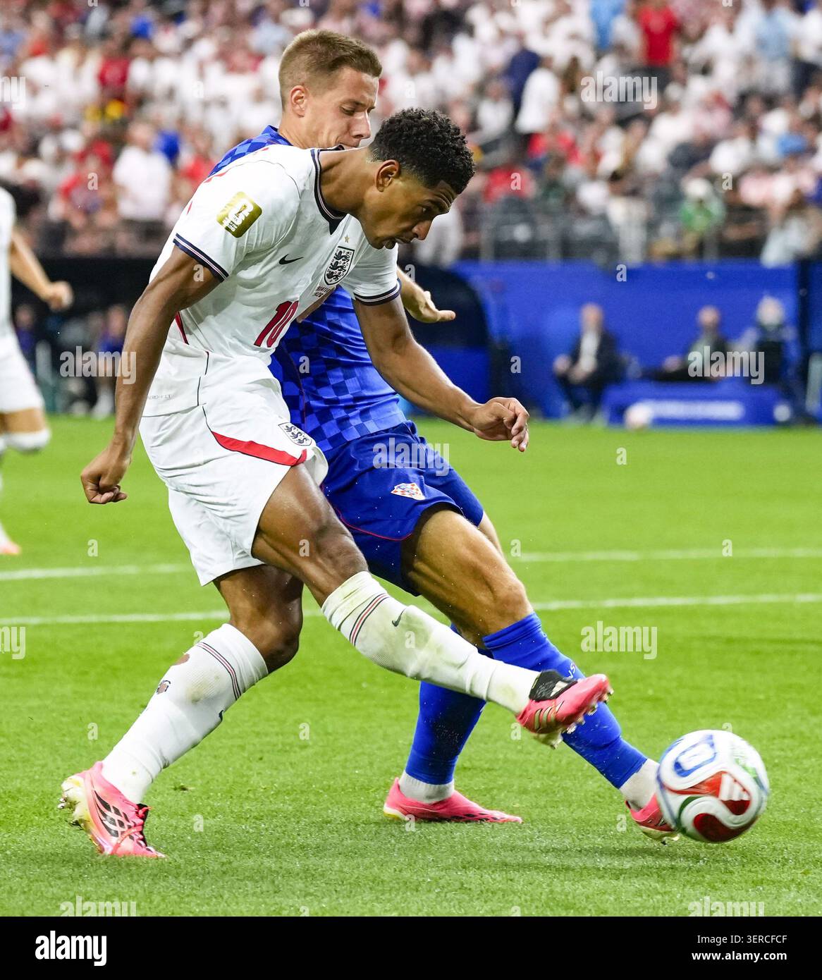 England's Jude Bellingham (front) scores the team's third goal in the ...