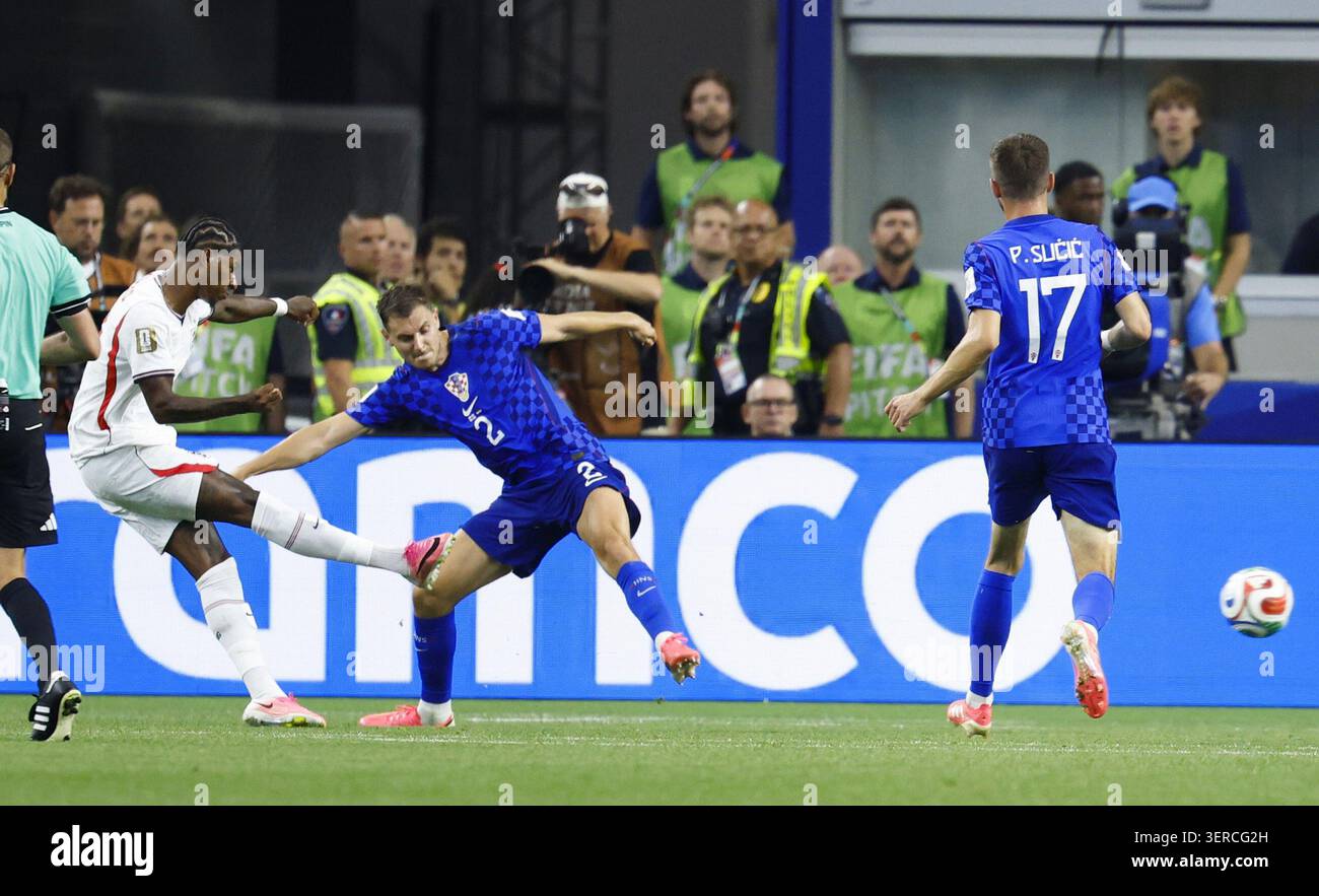 England's Marcus Rashford (L) scores the team's fourth goal in the ...