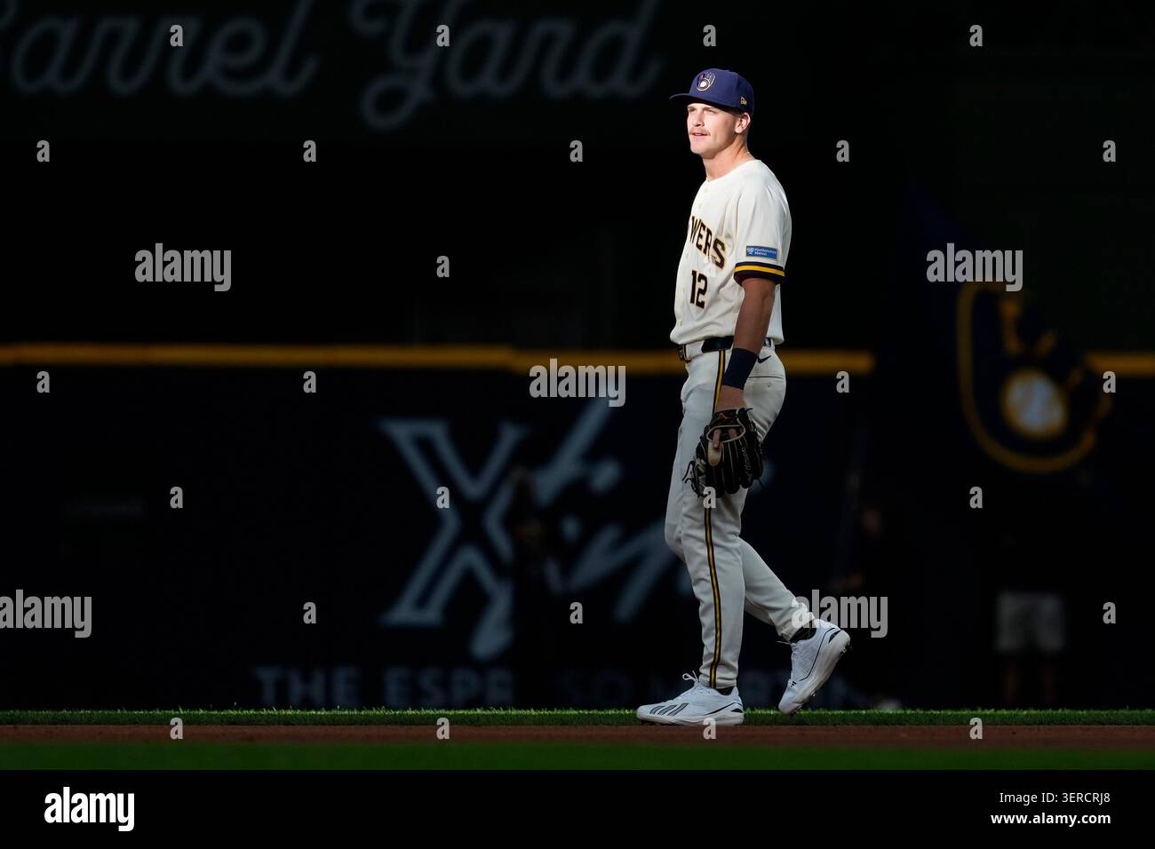 Milwaukee Brewers' Cooper Pratt looks on before a baseball game against ...