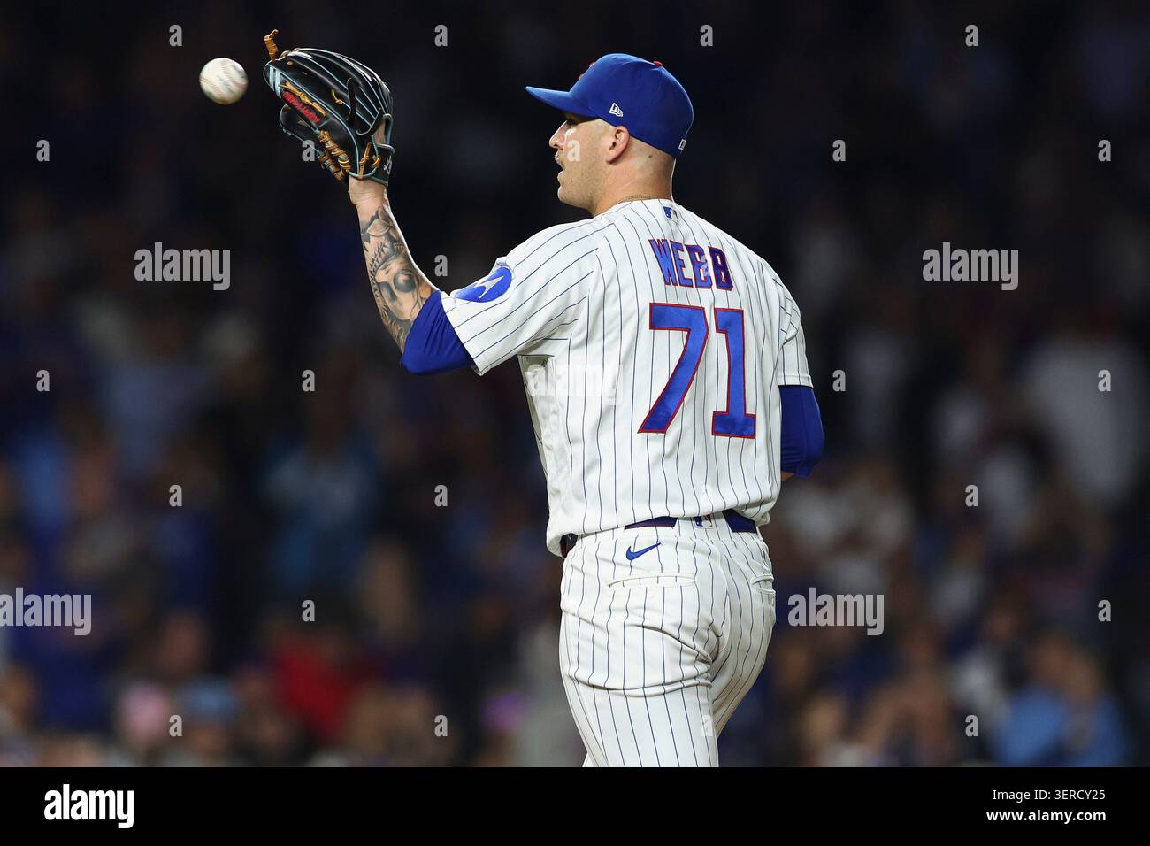 Chicago Cubs pitcher Jacob Webb (71) catches the ball during the ninth ...