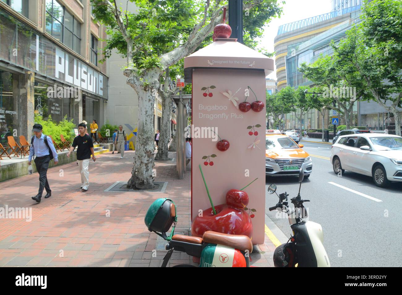 A self-service phone booth decorated with cherry ornaments adds a touch ...