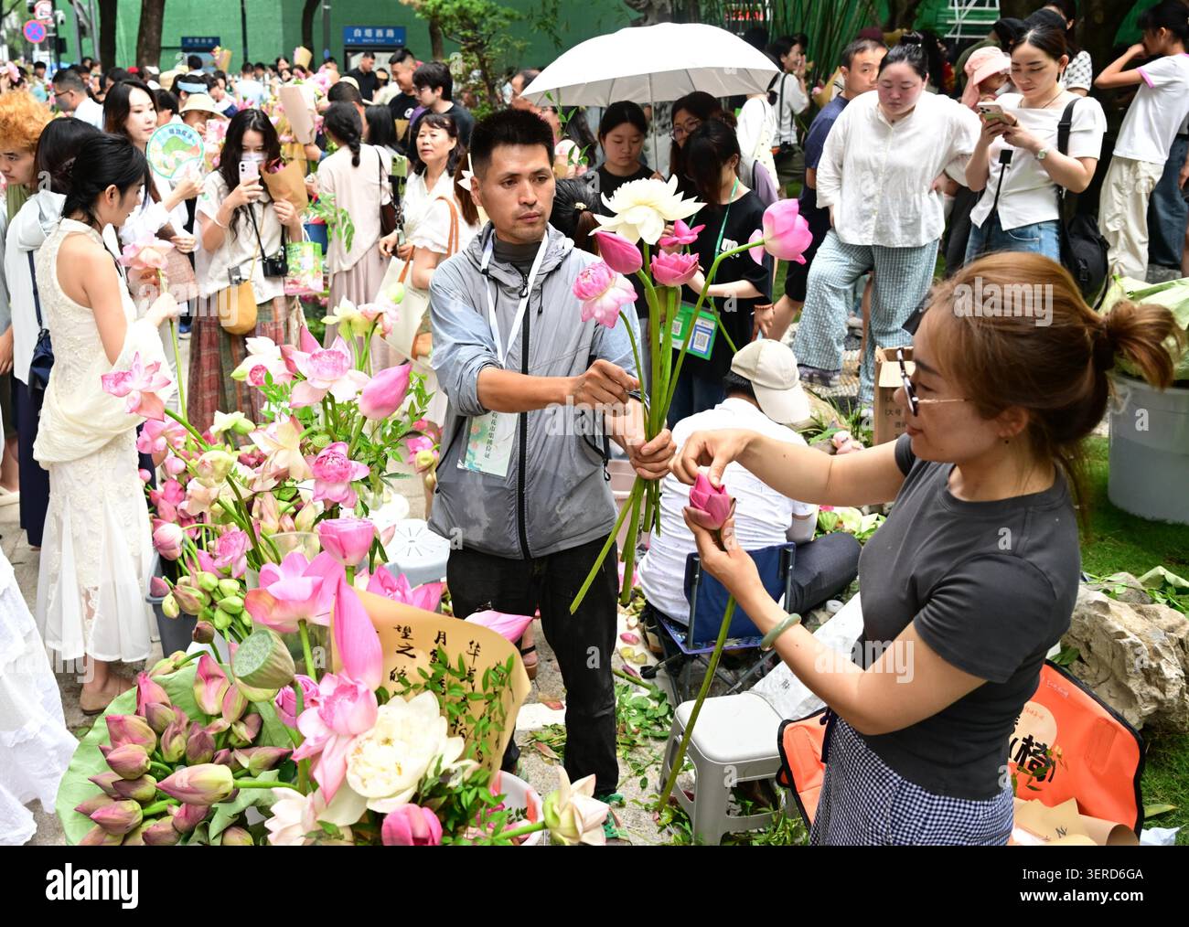Visitors crowd at the upgraded Lotus Market with over 100 stalls ...