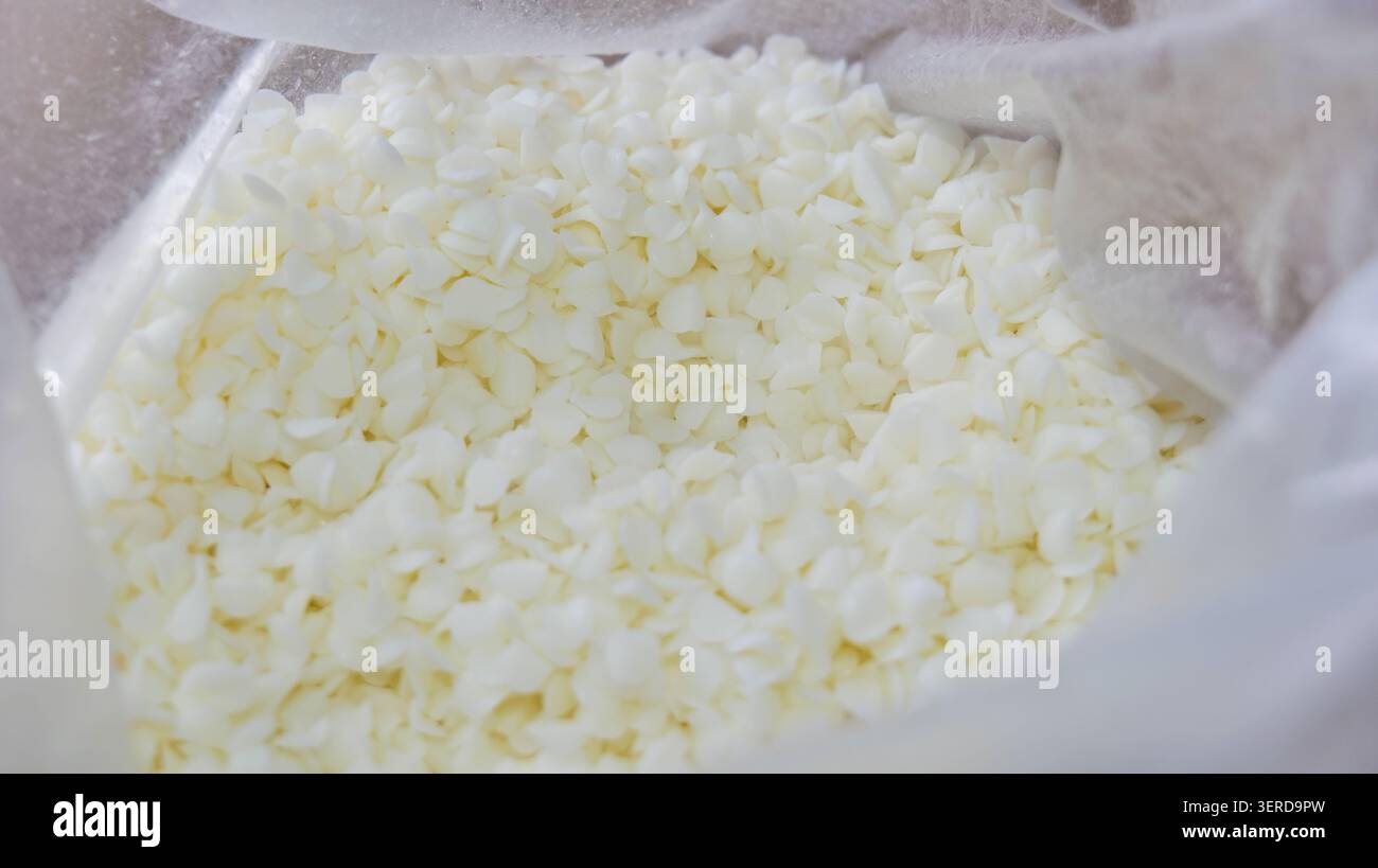 Close-up of white soy wax flakes for candle making Stock Photo - Alamy