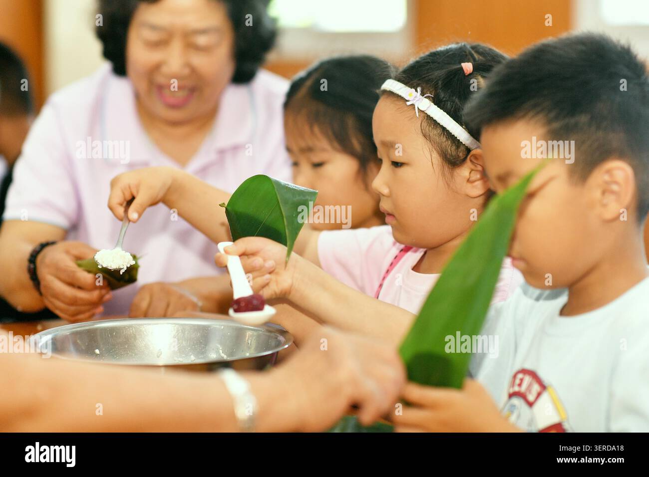 Villagers make zongzi and sachets to celebrate the Dragon Boat Festival ...