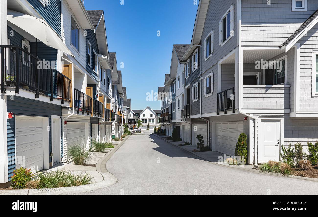 New townhouses in residential comfortable neighborhood on a sunny day ...