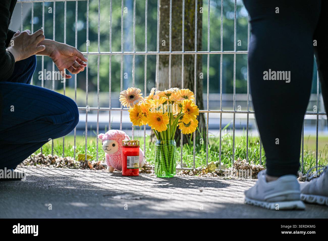 Schorndorf, Germany. 18th June, 2026. A woman lays flowers at the scene ...
