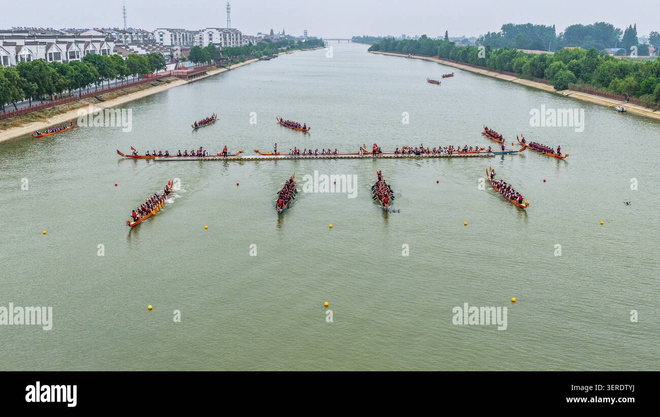 Teams compete during the 7th Sihong County Dragon Boat Race on the ...