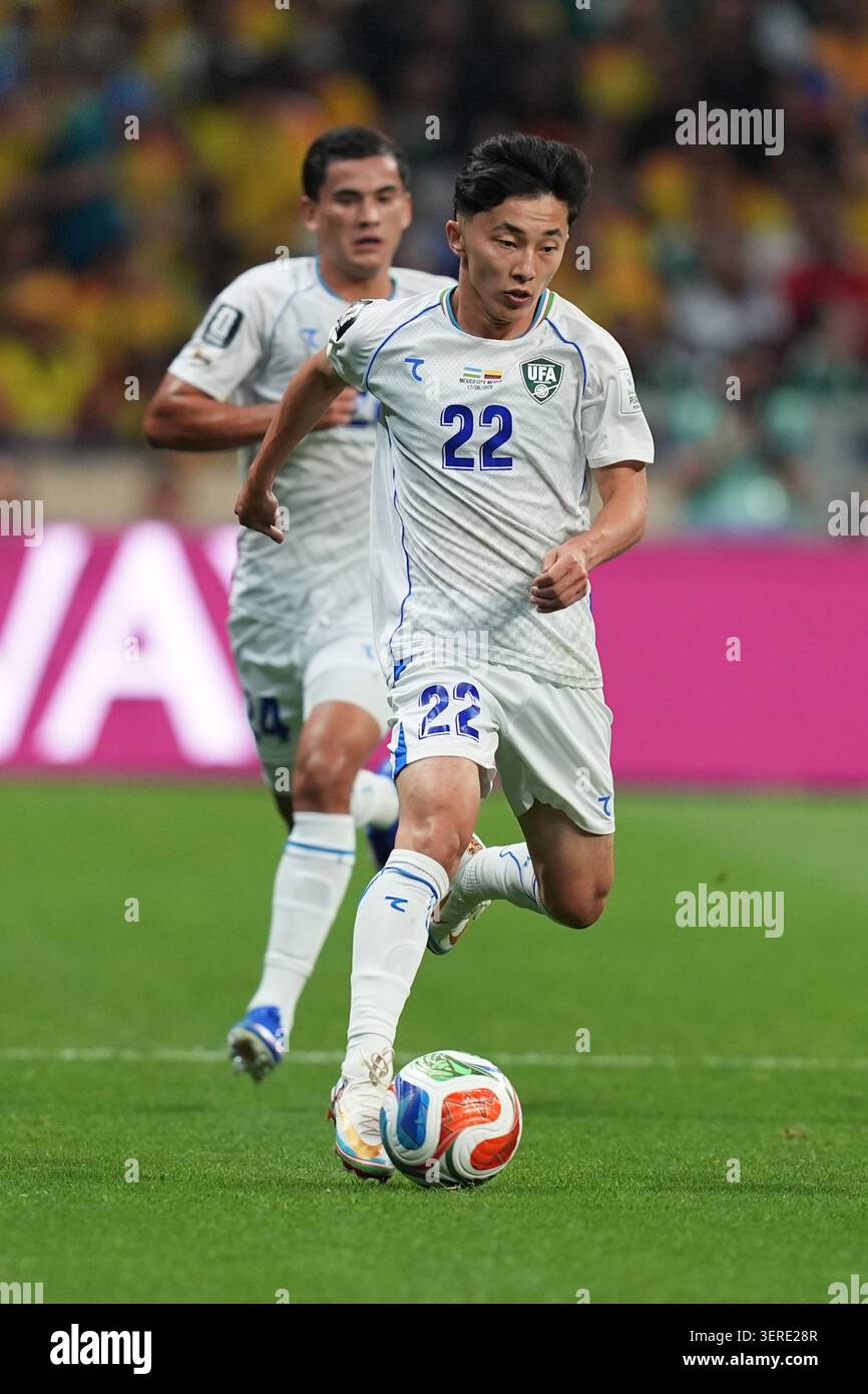 Abbosbek Fayzullaev #22 of Uzbekistan runs whit the ball during the ...
