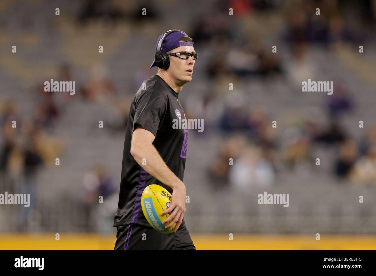 Mason Cox of the Dockers is seen warming up before the AFL Round 15 ...