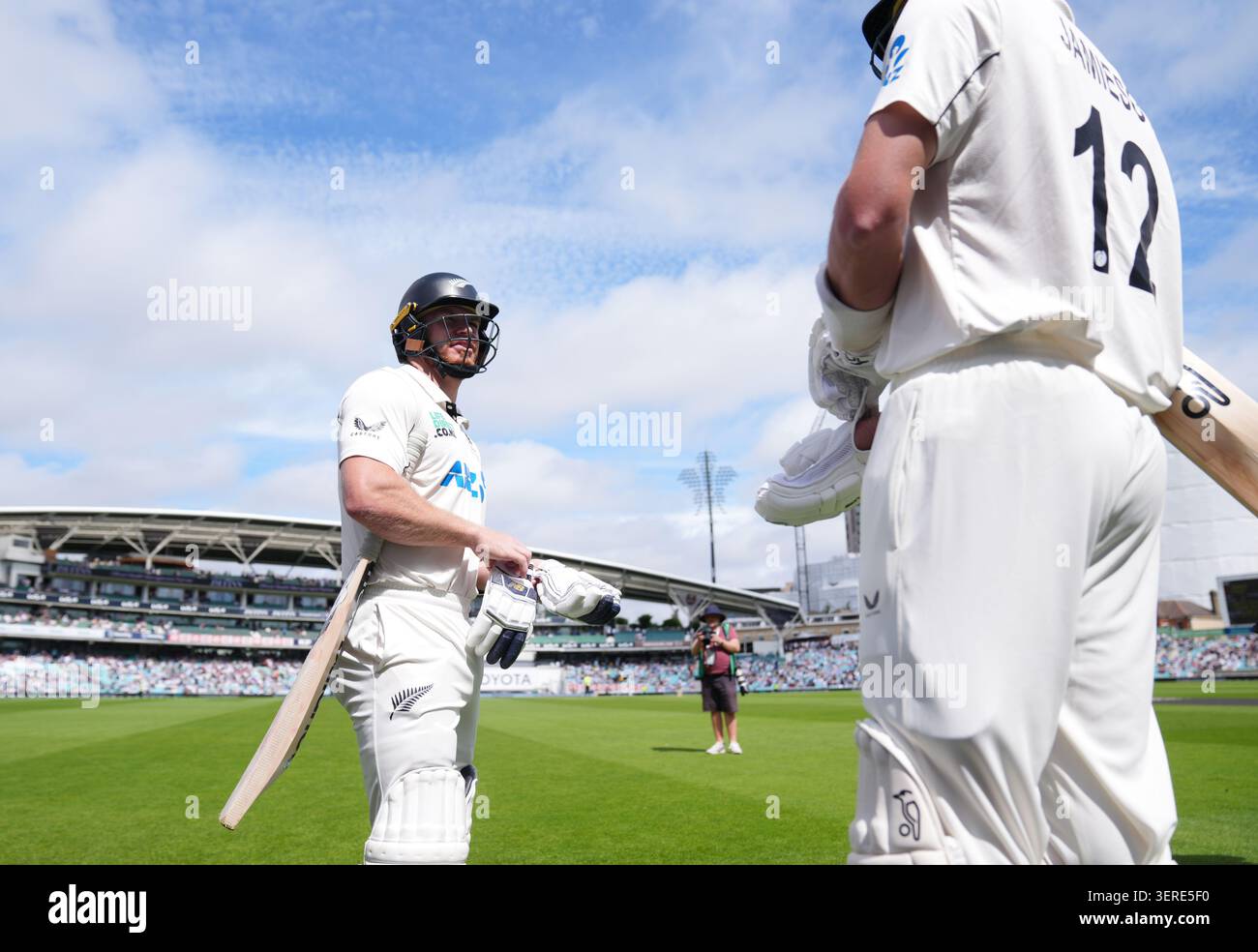 New Zealand's Glenn Phillips (left) and Kyle Jamieson head out to bat ...